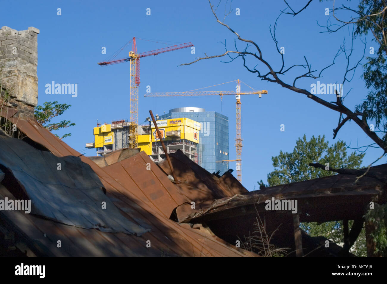 Modern High Rise Building and Traditional Home Stock Photo - Alamy