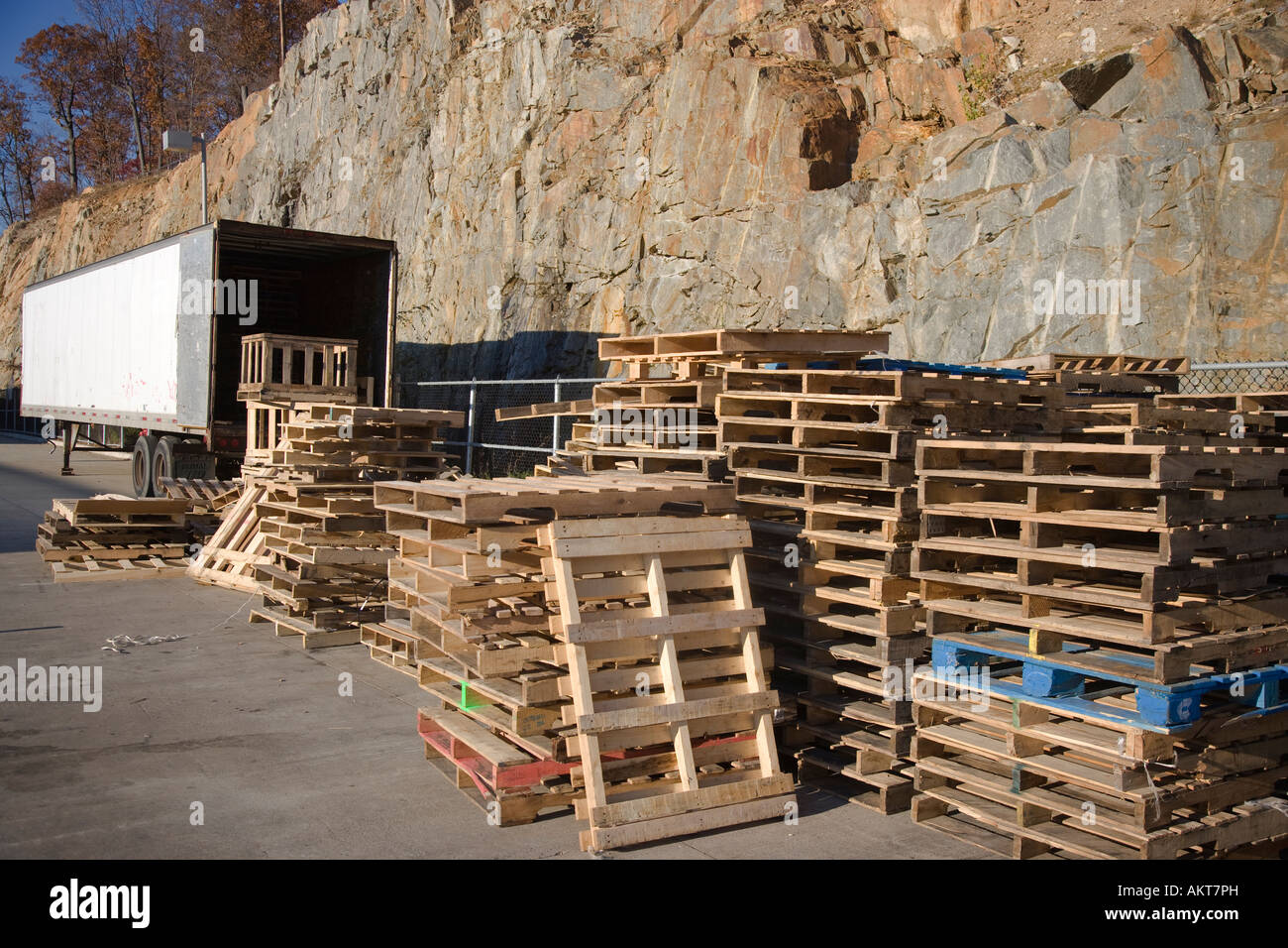 Empty pallets behind a truck Stock Photo - Alamy