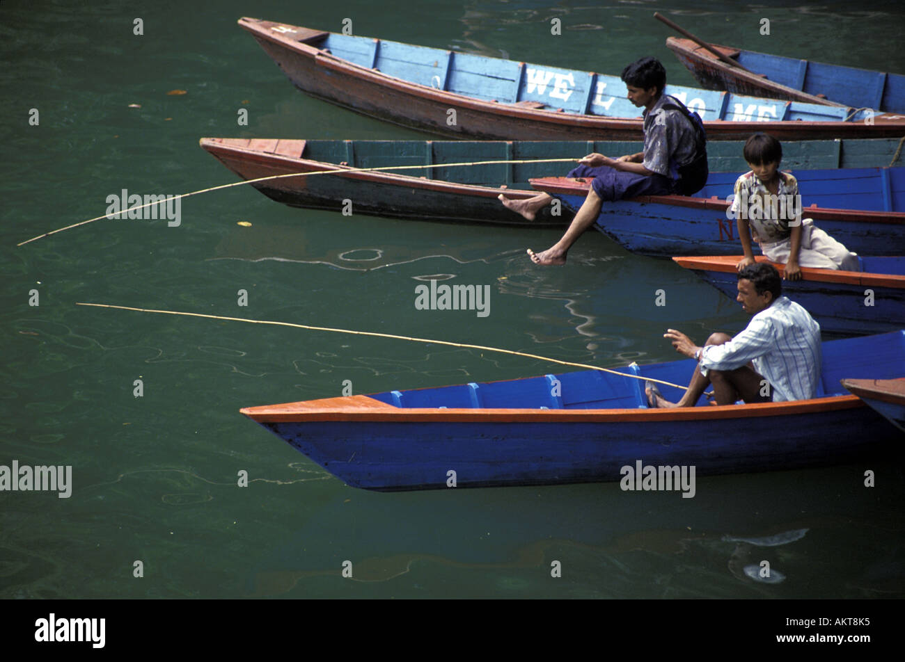 lake Phewa Tal Pokhara boats fishermen Nepal Stock Photo - Alamy
