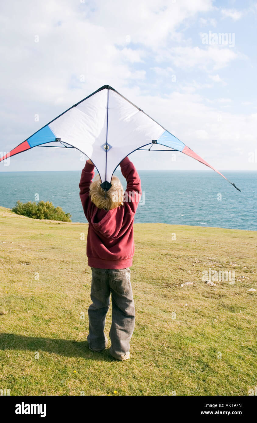 Colour portrait of young boy flying his kite Stock Photo - Alamy