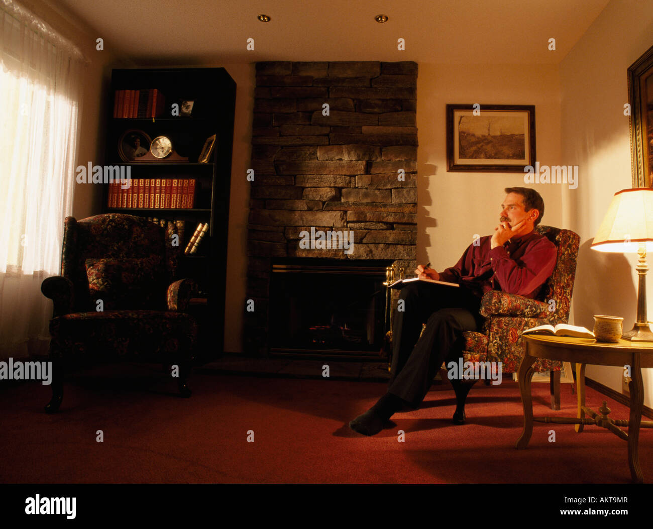 A man sitting in his study Stock Photo - Alamy