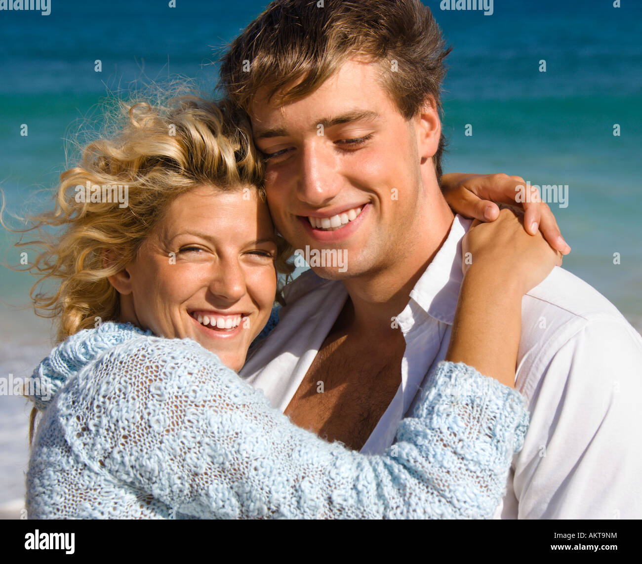 Happy smiling couple embracing on Maui Hawaii beach Stock Photo - Alamy