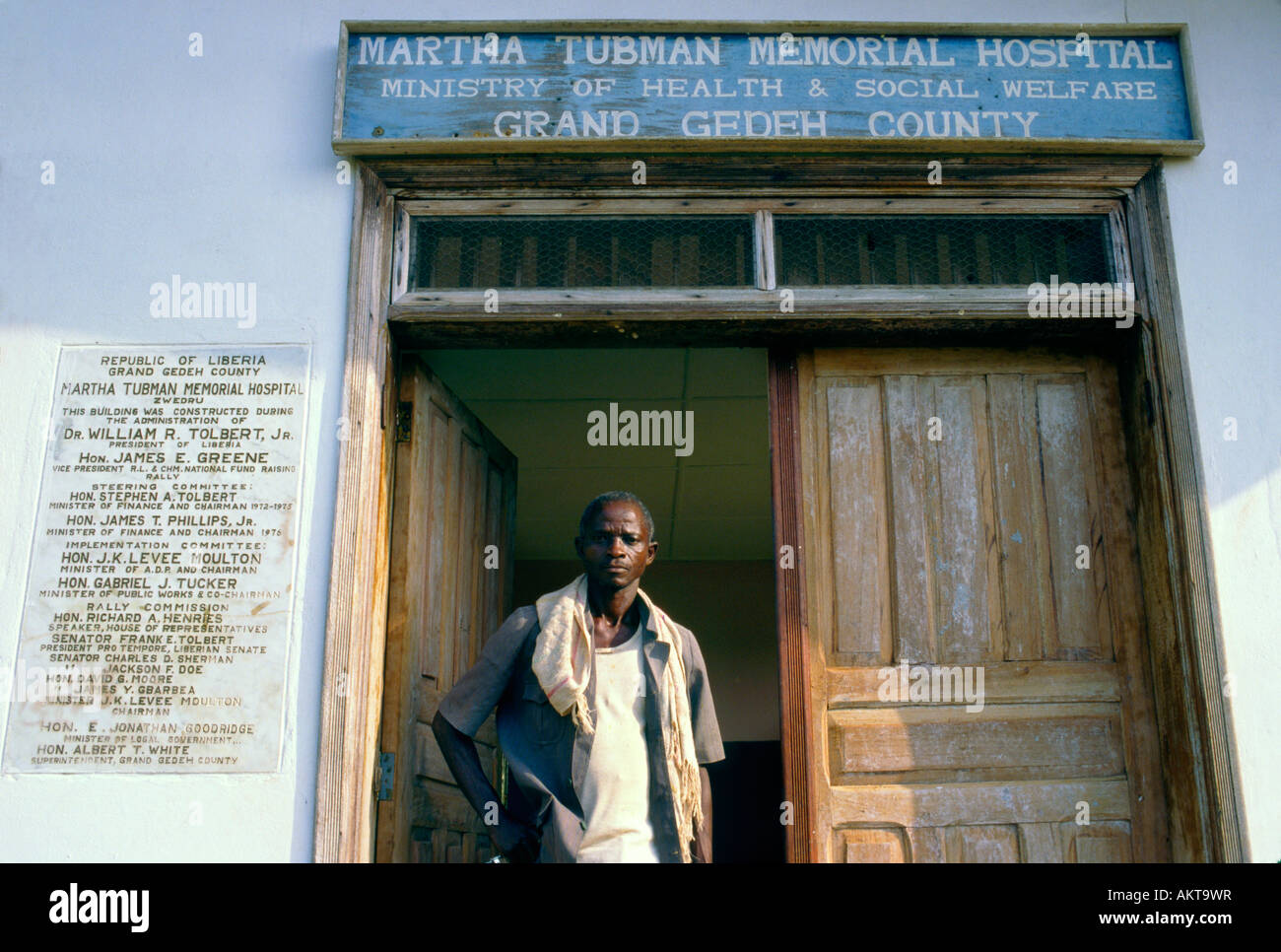 A man stands in the entrance to Martha Tubman Memorial Hospital in ...