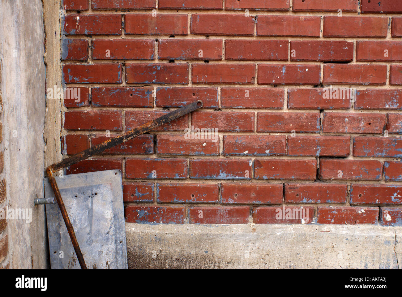 red brick wall with construction parts Stock Photo - Alamy