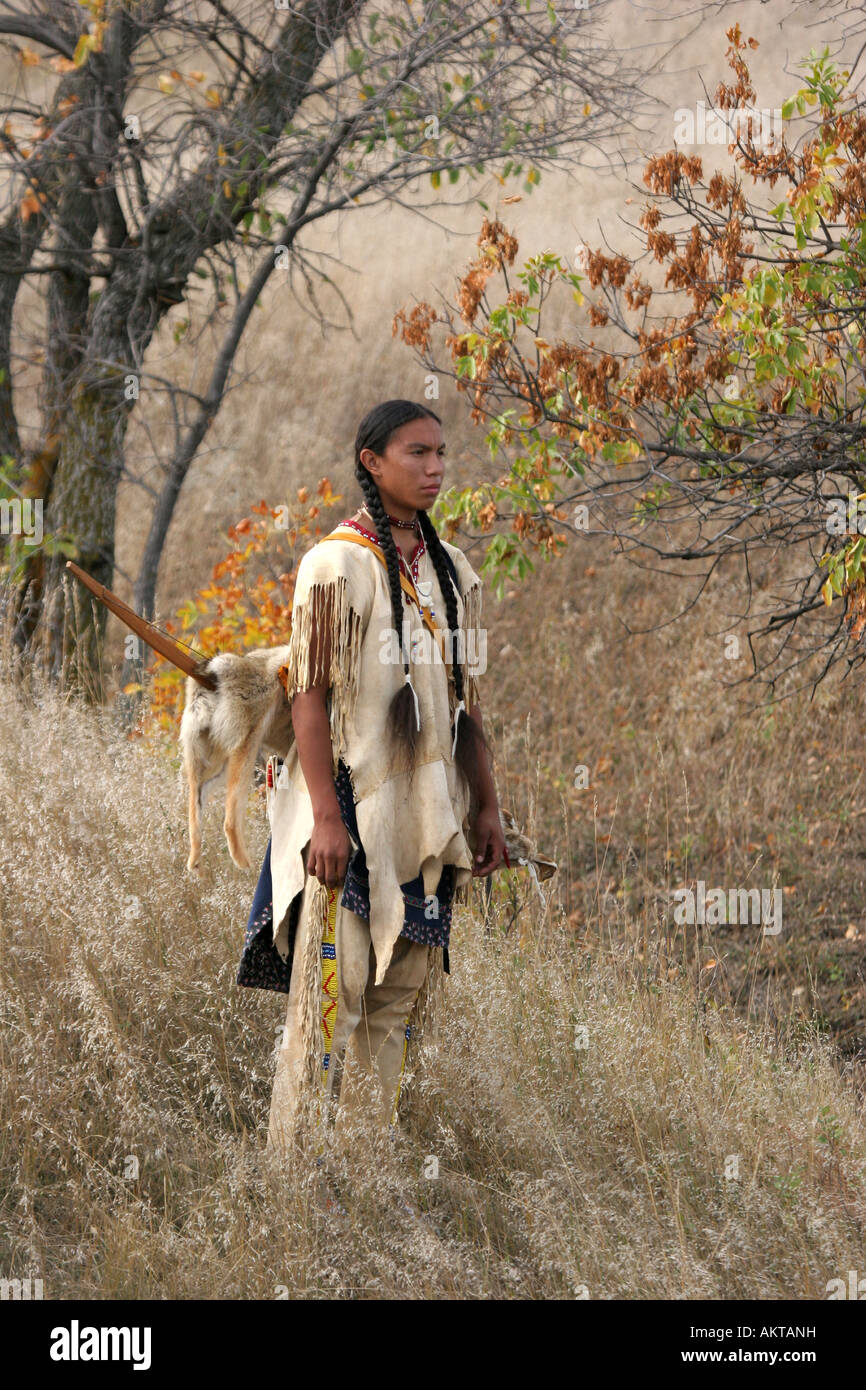 A serious male portrait of a young Native American Sioux Indian boy ...
