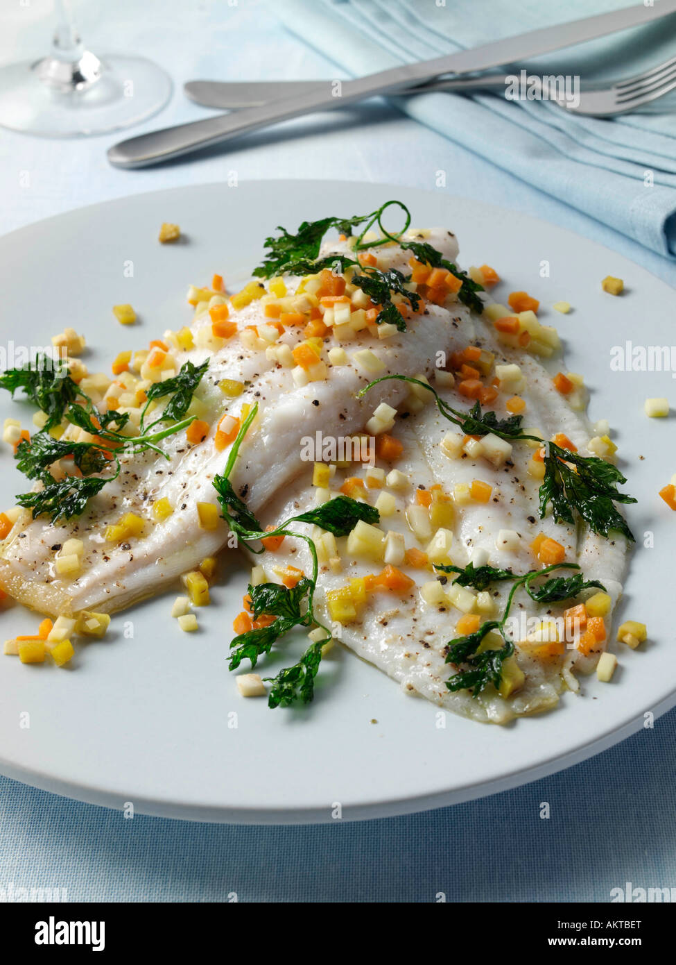 Two lemon sole fillets with root vegetable confetti gourmet editorial ...