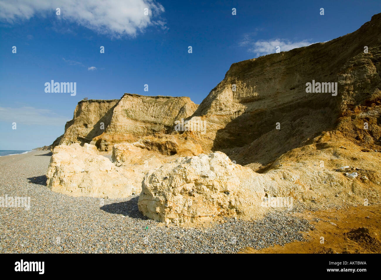 eroded sea cliffs on the head of the beach at Weybourne, Norfolk, UK ...