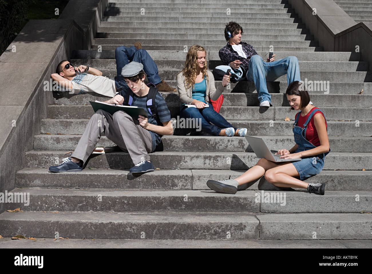 High school students sitting on steps Stock Photo - Alamy