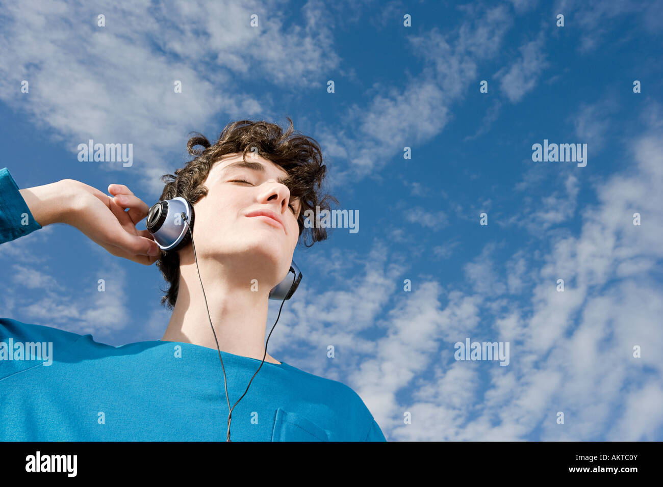 Teenage boy listening to music Stock Photo - Alamy