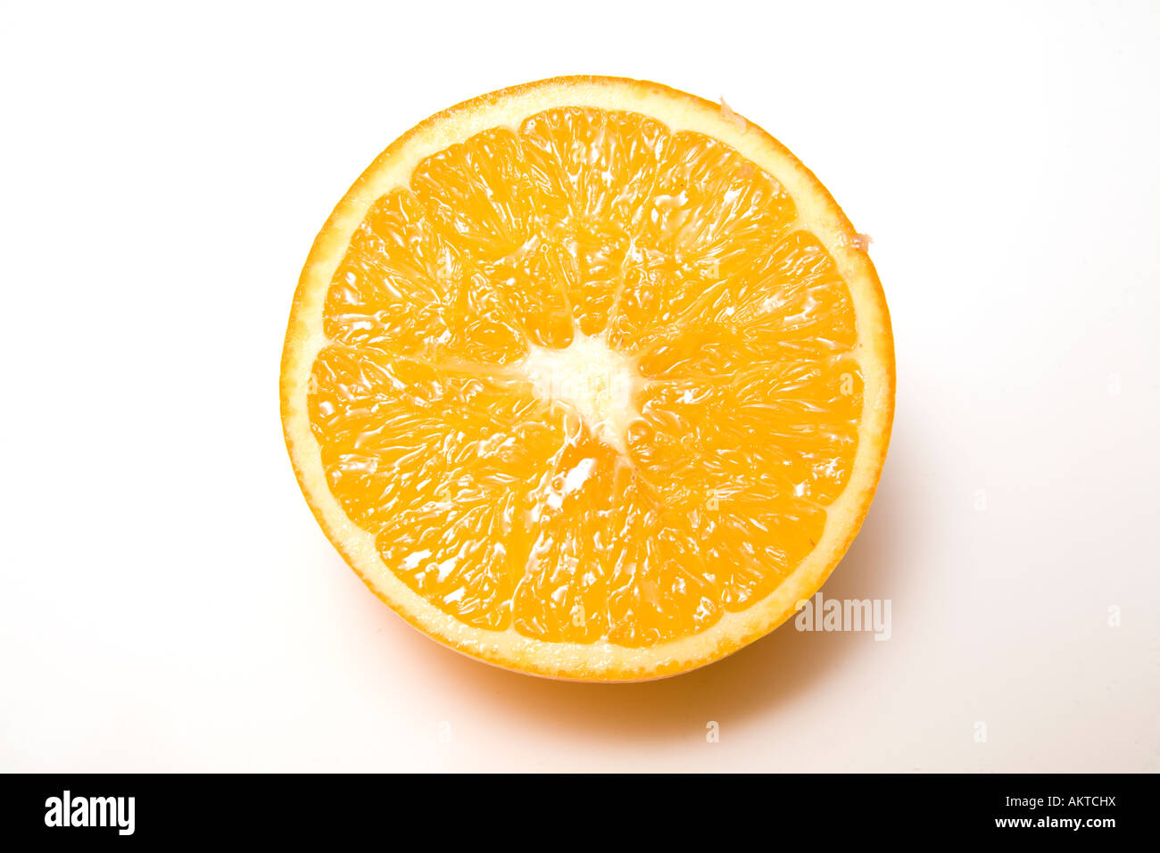 Orange halved and isolated on a white studio background Stock Photo - Alamy