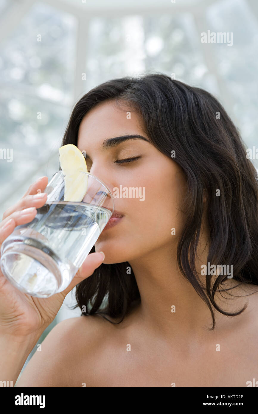 Woman drinking water Stock Photo - Alamy