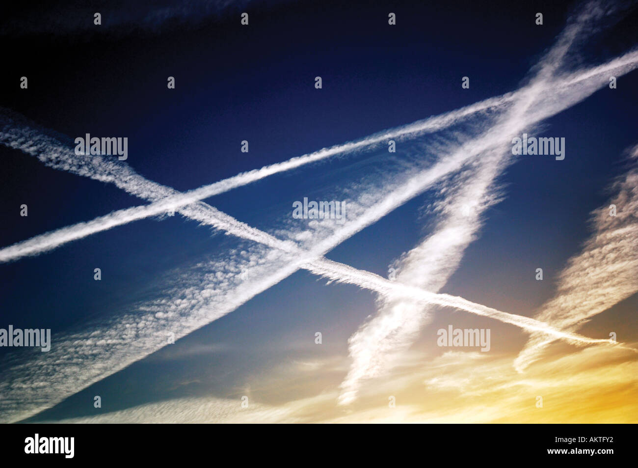 aircraft jet trails in sky Stock Photo - Alamy