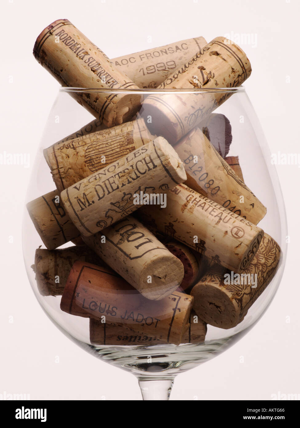 Corks in wine glass Stock Photo - Alamy