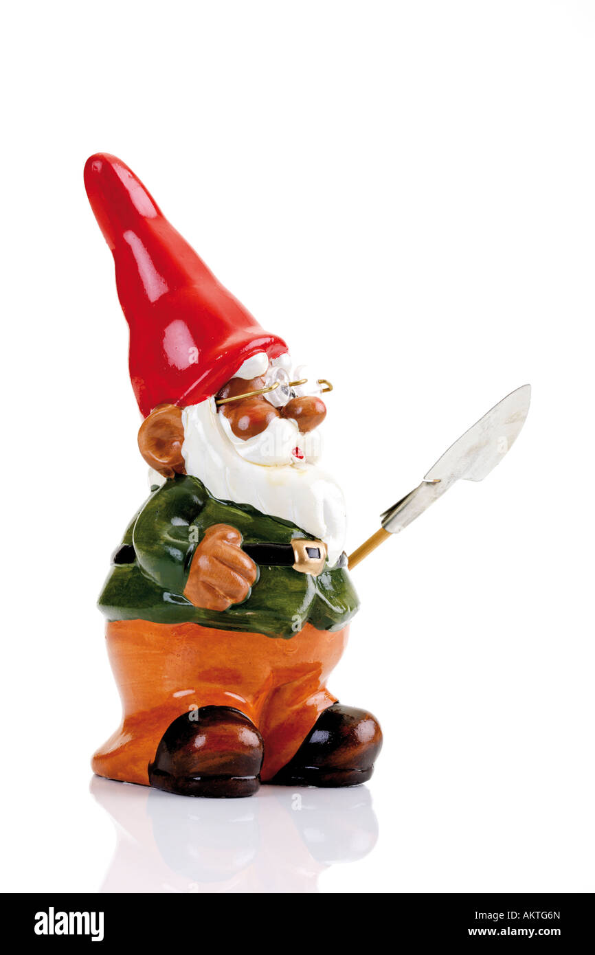 Garden gnome with spade, side view Stock Photo - Alamy