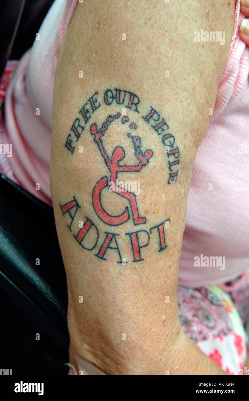 Woman with disability tatoo at march and rally for the anniversary of ...