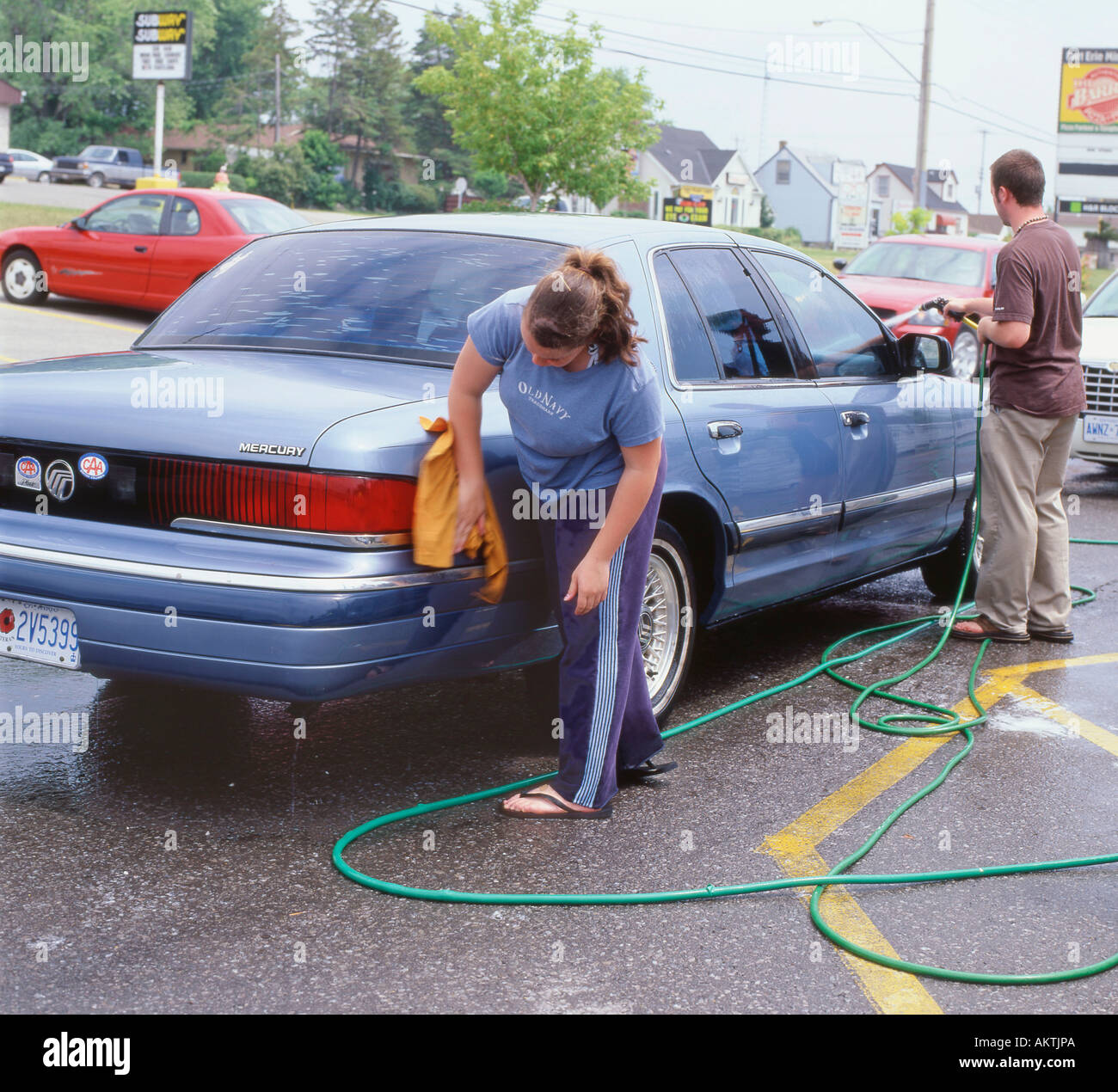 Teenager washing car hi-res stock photography and images - Alamy
