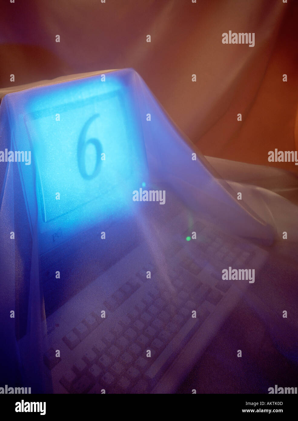 still life mysterious mystery transparent fabric draped over computer ...