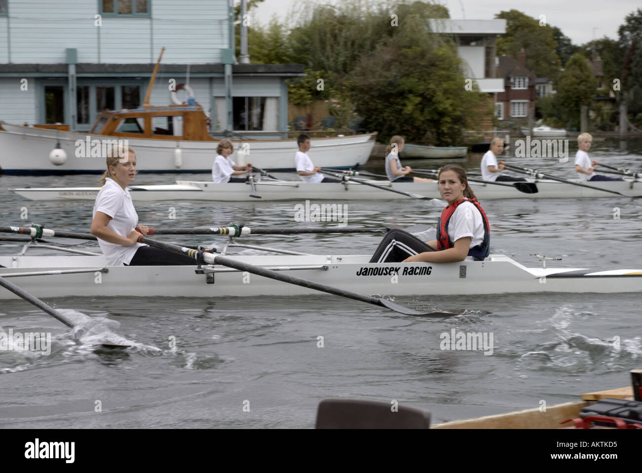 at the junior regatta two eights reach the finish line Stock Photo - Alamy