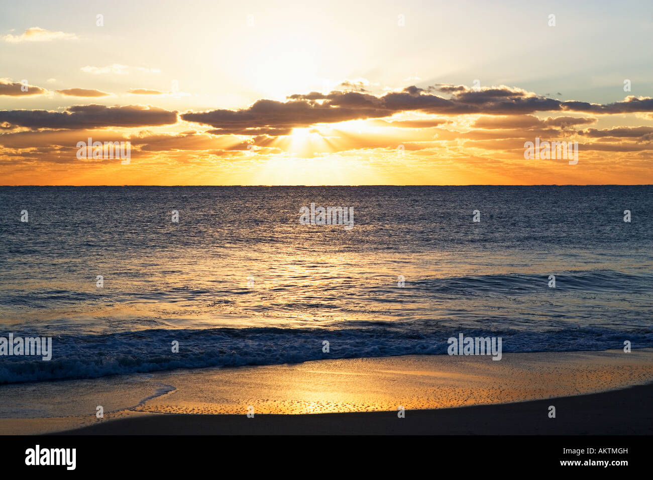 Sunset over the ocean Stock Photo - Alamy