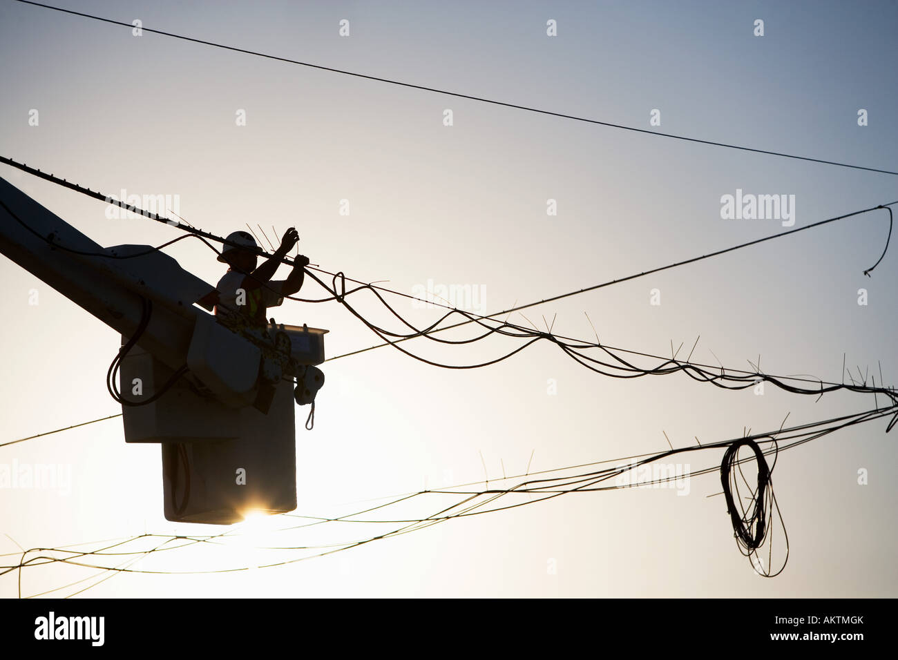 Person working on cables Stock Photo - Alamy