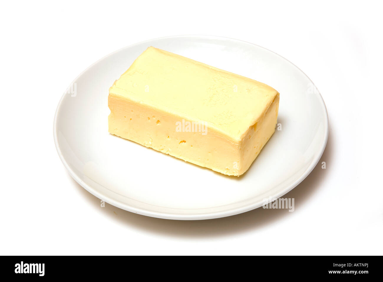 Slab of traditional butter on a white plate Stock Photo - Alamy