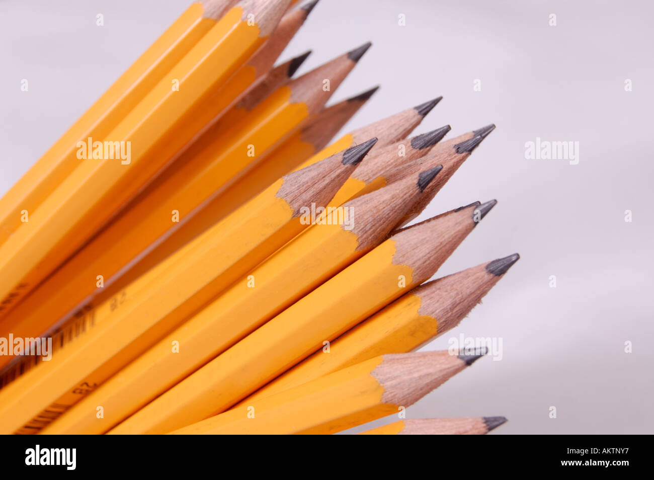Yellow Pencils on a white background Stock Photo - Alamy