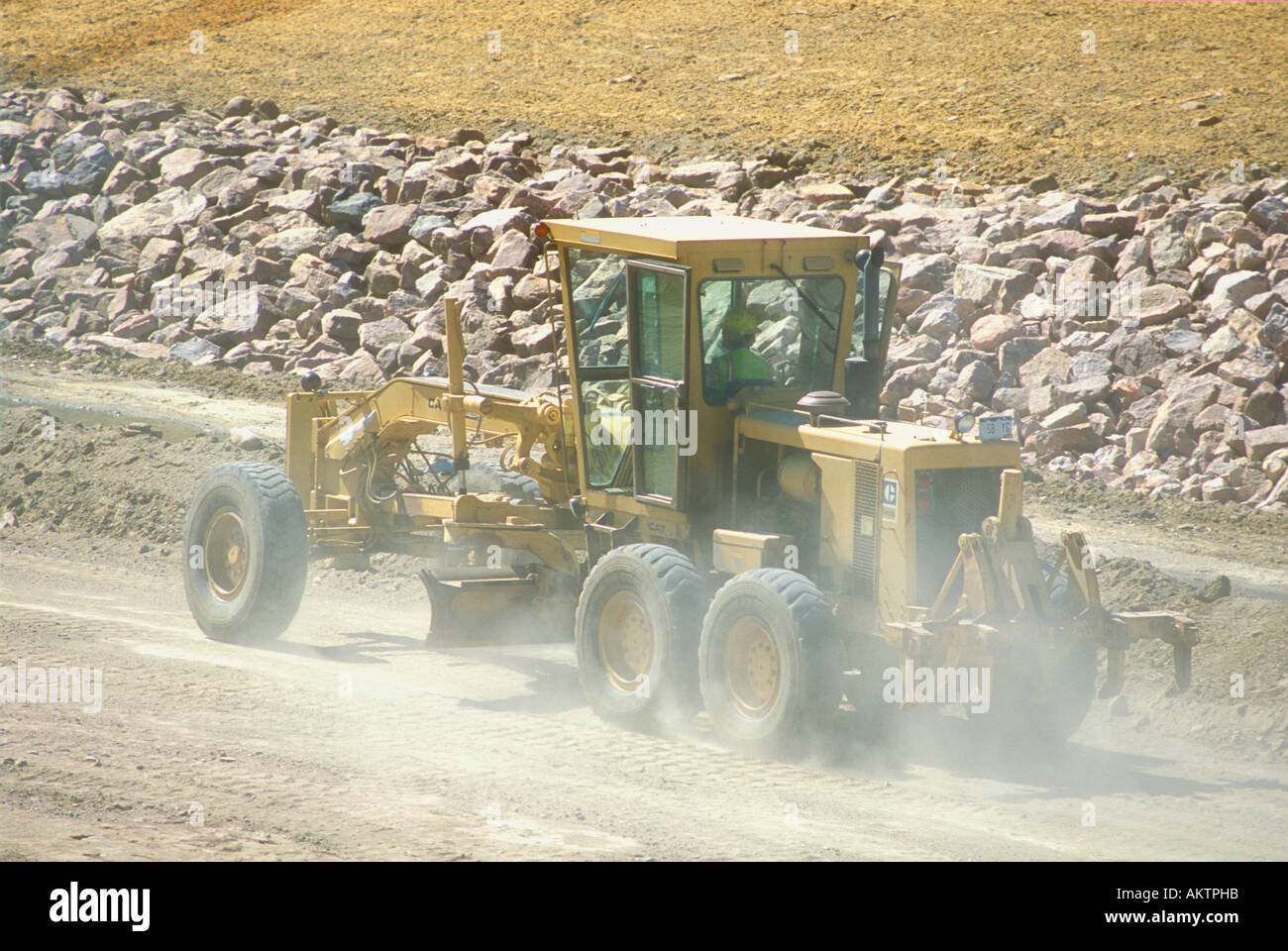 Cat or Caterpillar road grader used for leveling construction sites ...