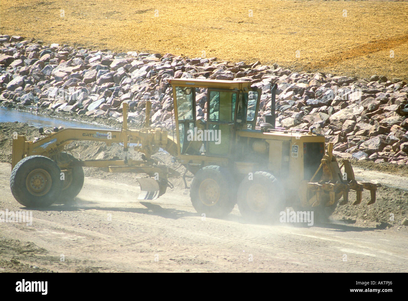 Cat or Caterpillar road grader used for leveling construction sites ...