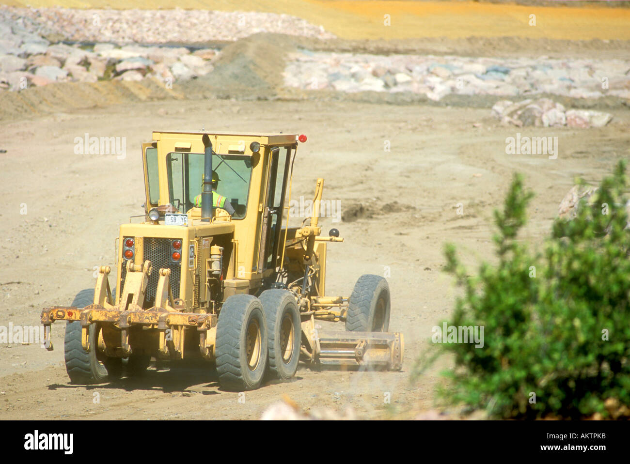 Cat or Caterpillar road grader used for leveling construction sites ...