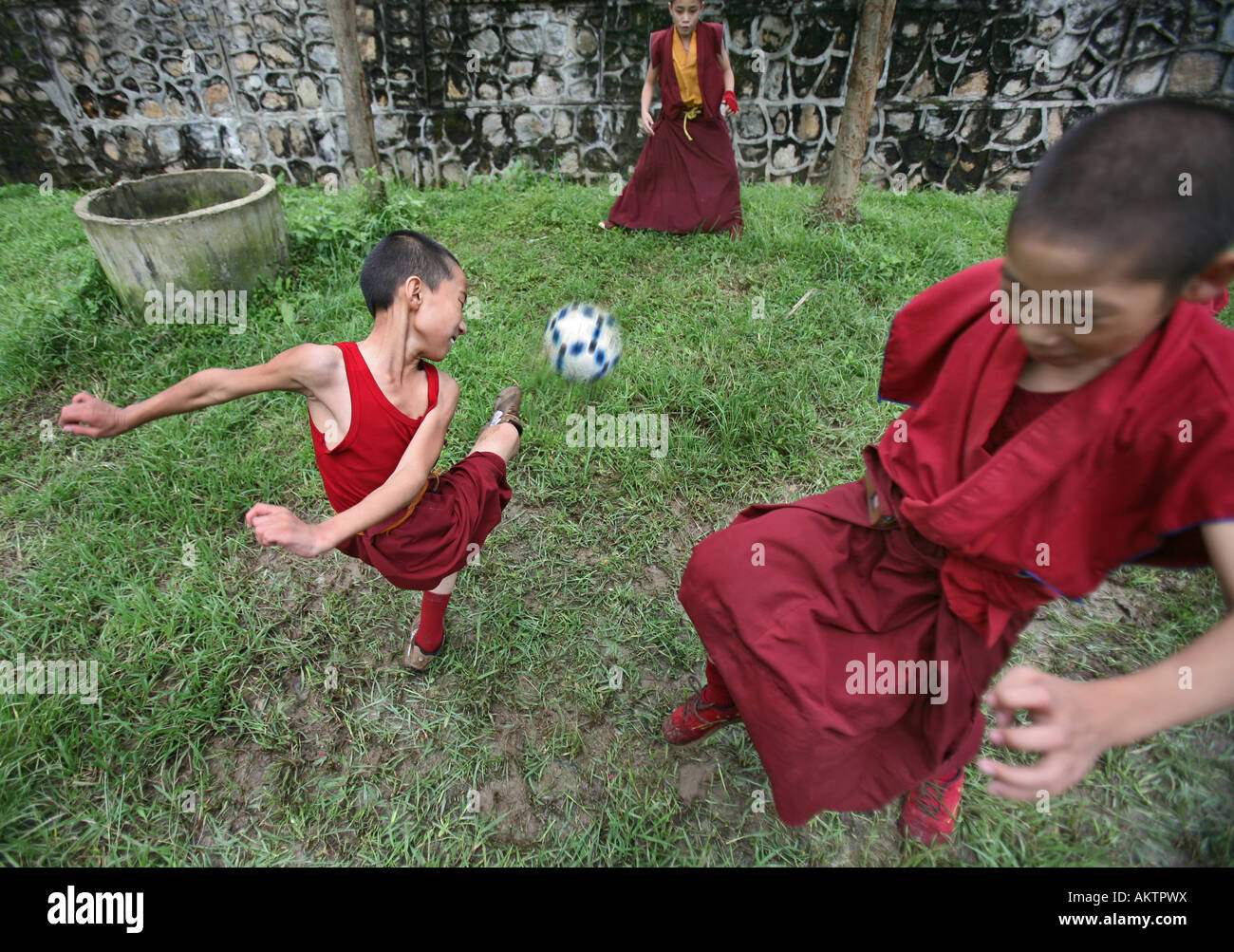 Boy playing football kathmandu hi-res stock photography and images - Alamy