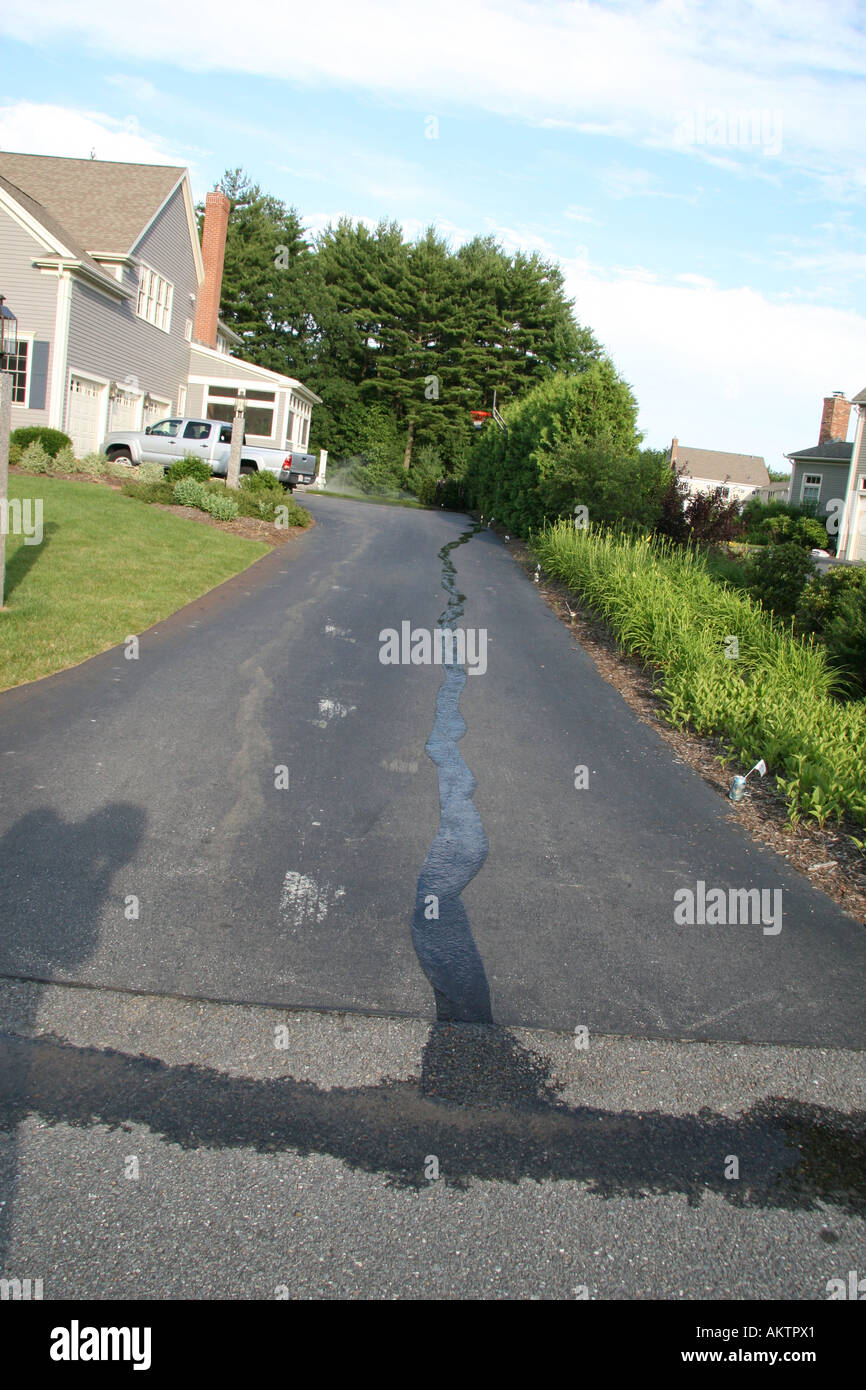Runoff from sprinklers wasting water Stock Photo - Alamy