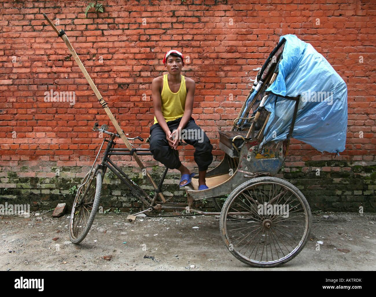 Rickshaw driver in Kathmandu Stock Photo - Alamy