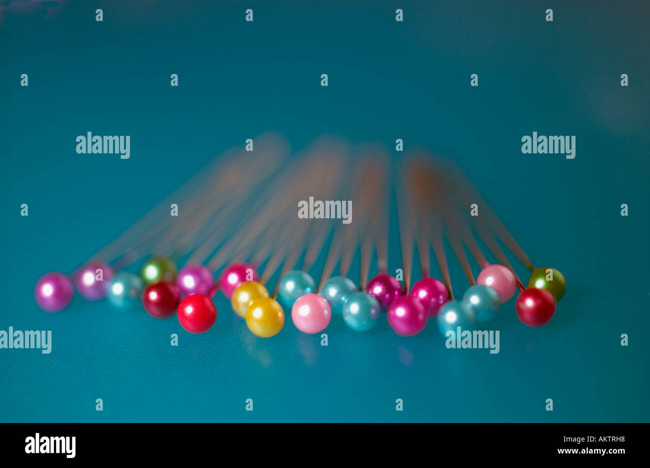 COLORED PINS IN A ROW Stock Photo - Alamy