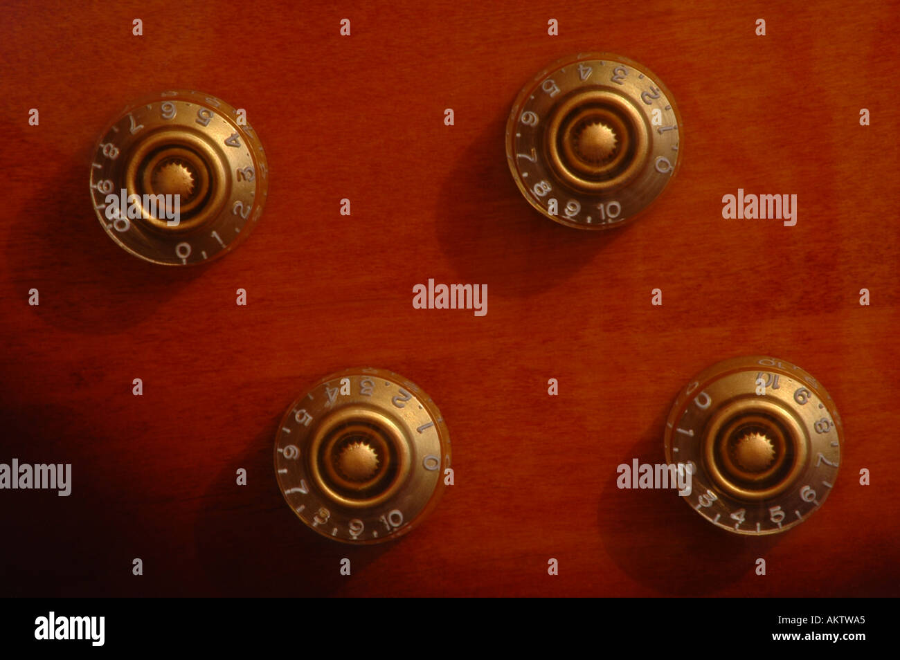 Close up view of volume and tone controls from a gibson epiphone ...