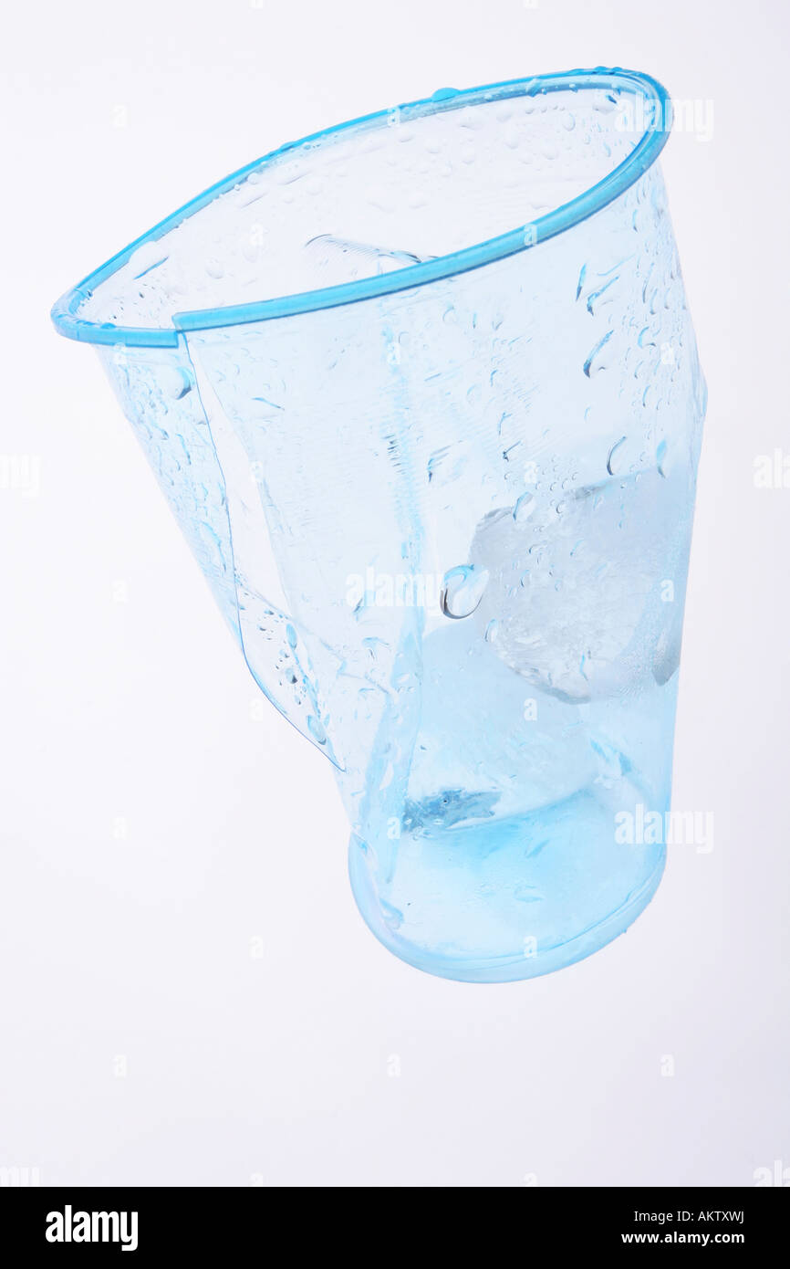 Clear blue plastic cup crumbled and broken Stock Photo - Alamy