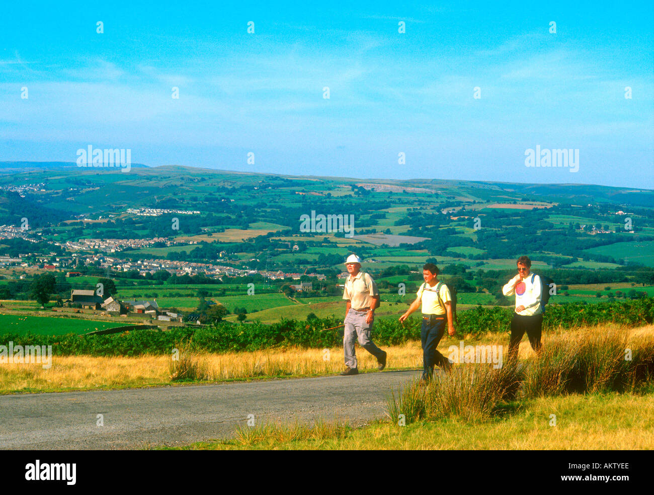 Group walking on country road hi-res stock photography and images - Alamy