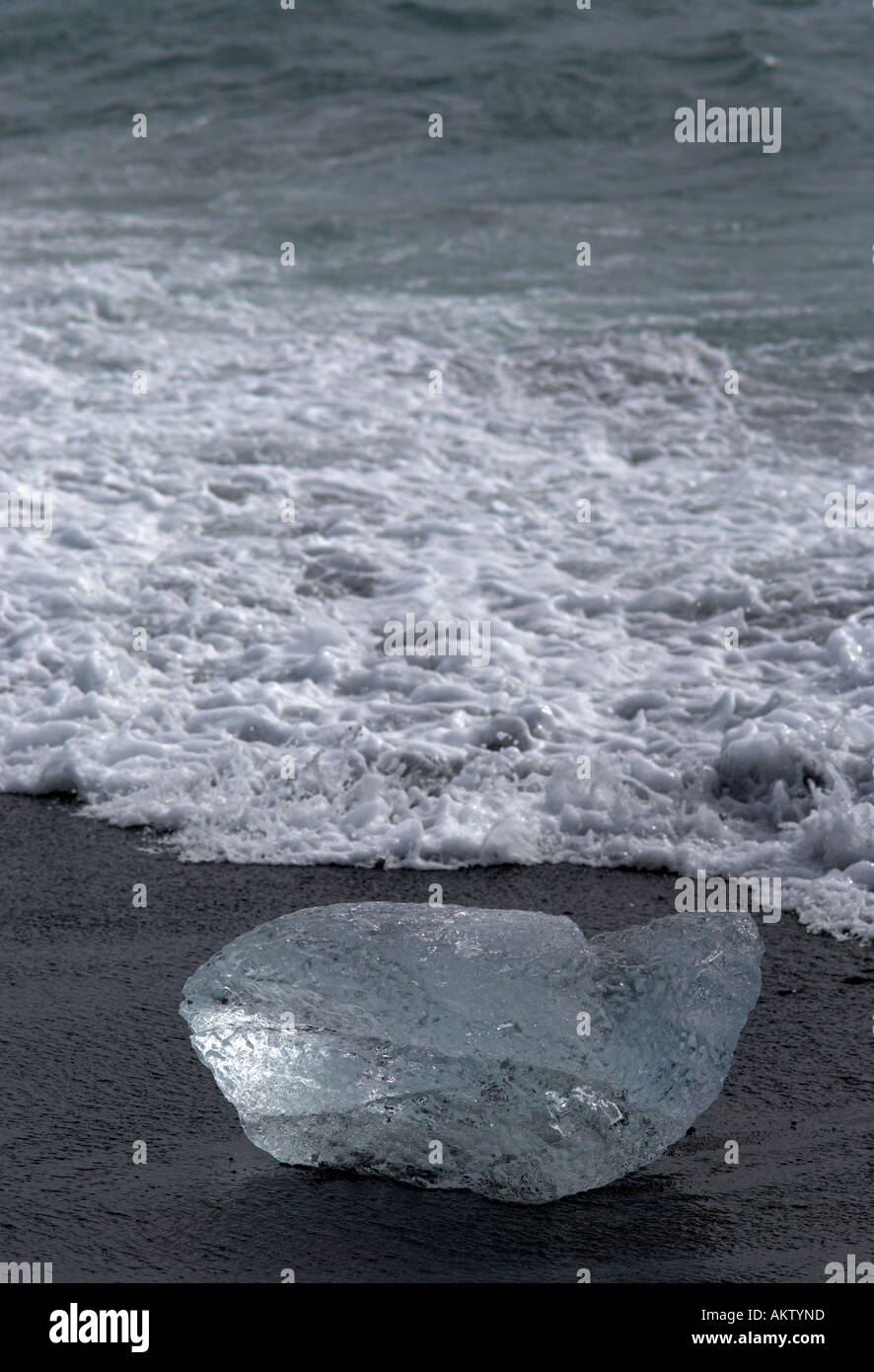 Ice block lying on the beach. Iceland Stock Photo - Alamy