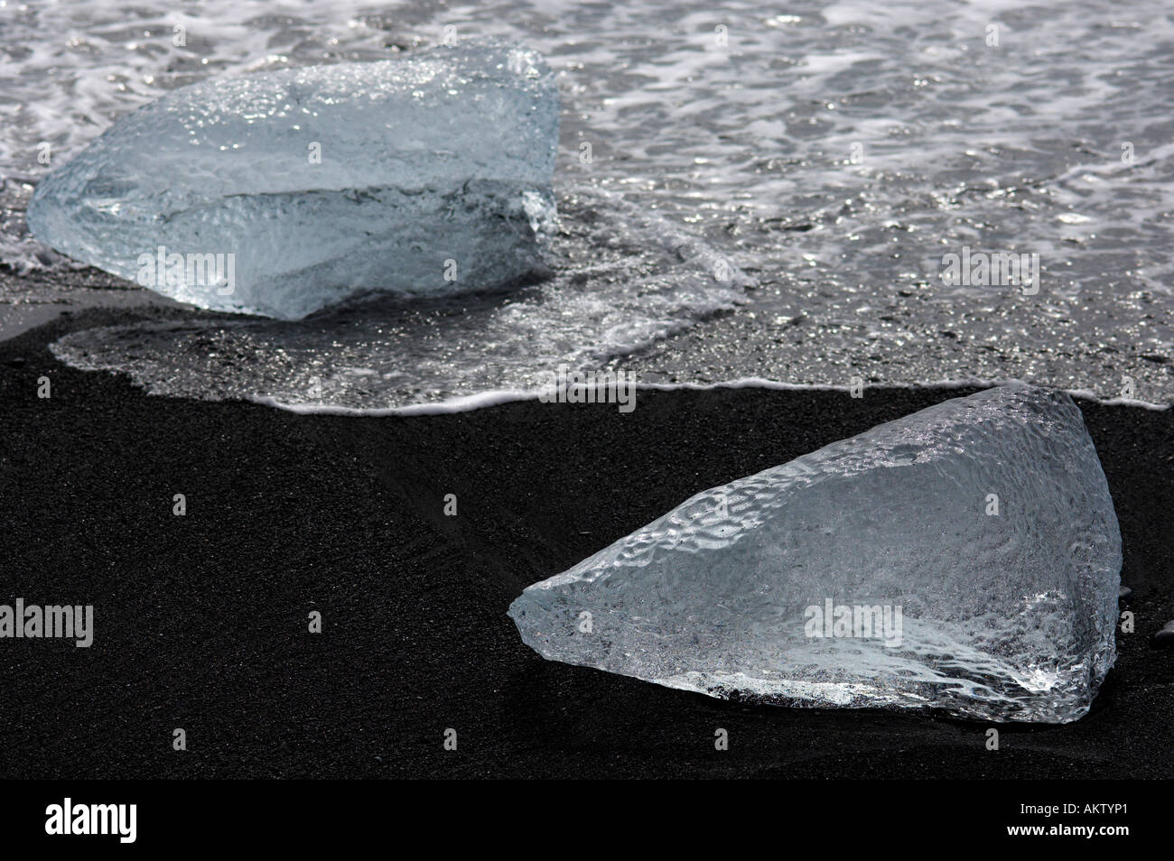 Ice block lying on the beach. Iceland Stock Photo - Alamy