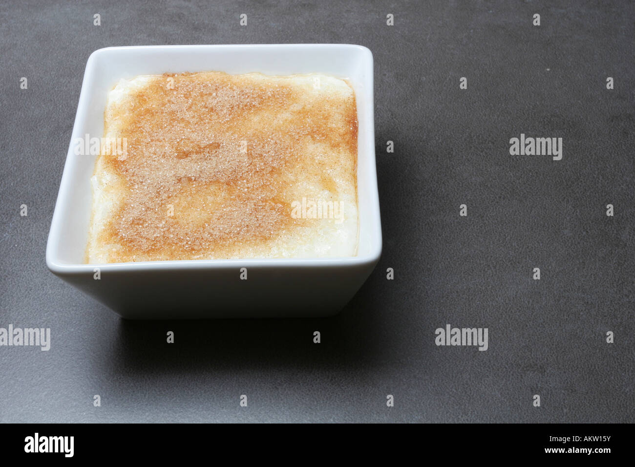 hot rice pudding with cinnamon sugar in a square bowl Stock Photo - Alamy