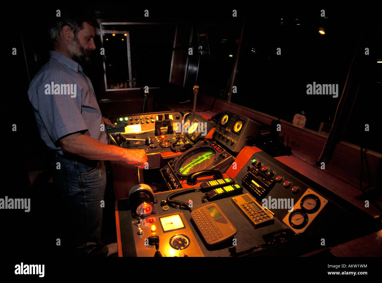 Inland shipping on the Dutch rivers a shipper at night steering in the ...