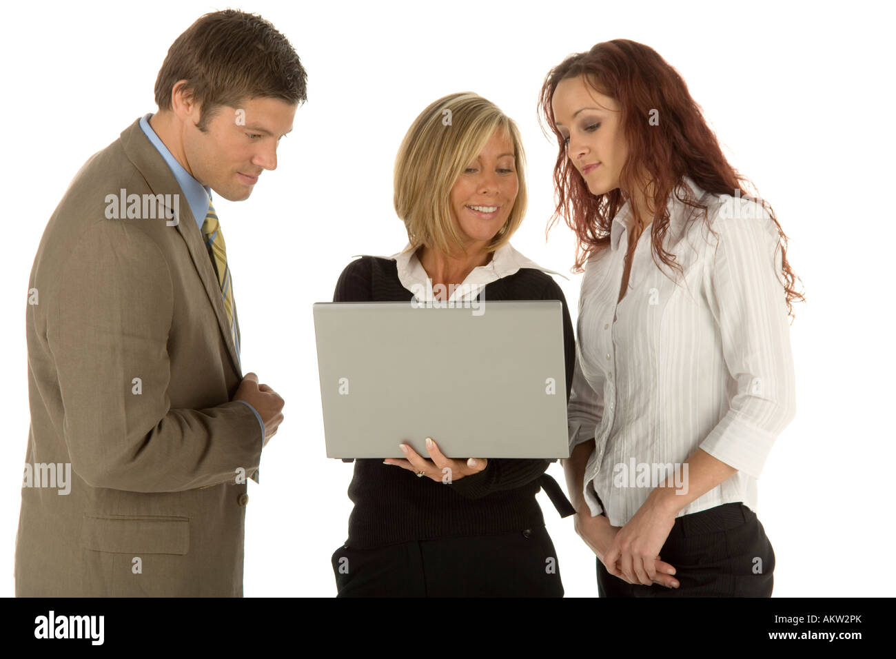 Young women and man studying a laptop computer in an office environment ...