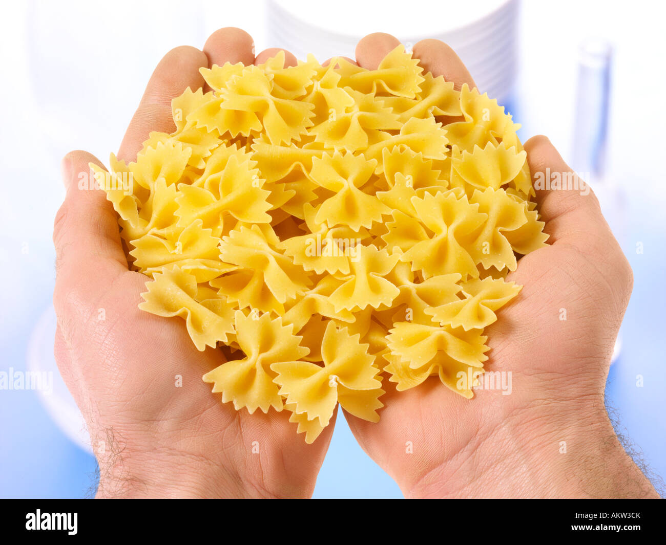 HANDFUL OF FARFALLE PASTA Stock Photo - Alamy