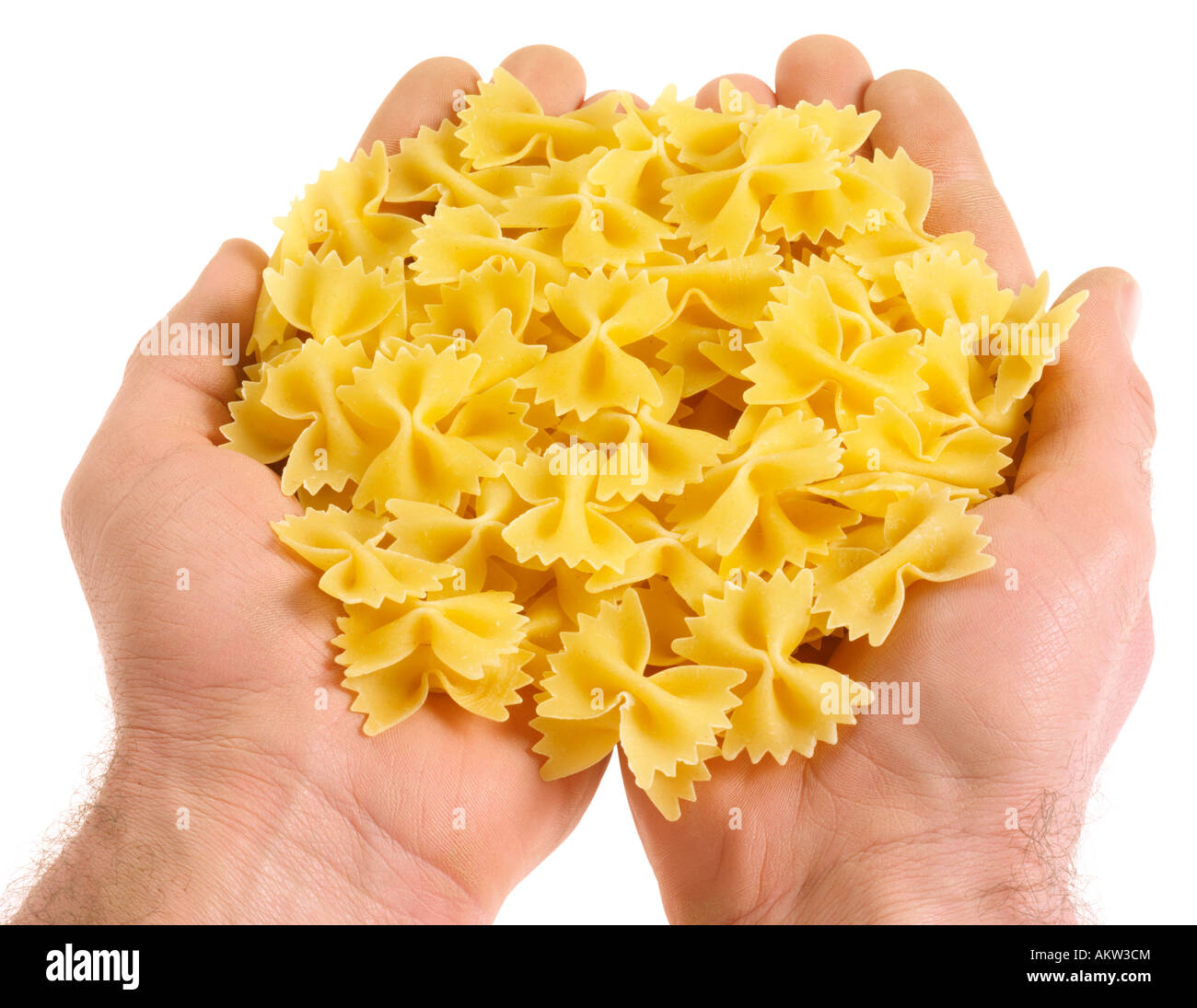 HANDFUL OF FARFALLE PASTA Stock Photo - Alamy