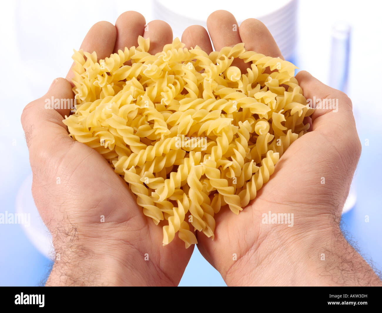 HANDFUL OF FUSILLI PASTA Stock Photo - Alamy