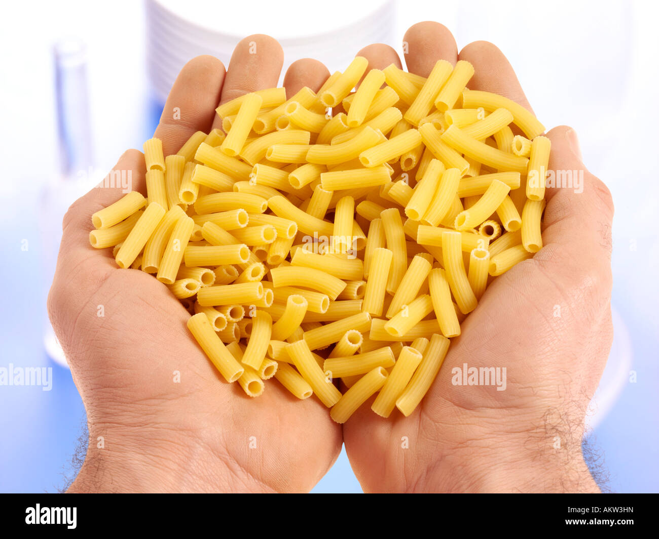 HANDFUL OF MACARONI PASTA Stock Photo - Alamy
