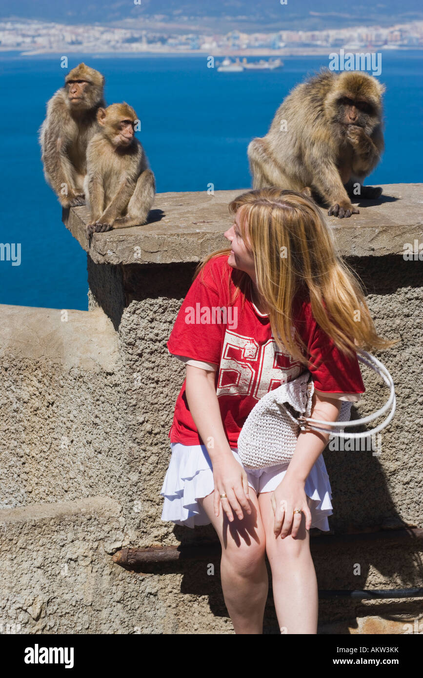 Gibraltar Young girl with apes Stock Photo - Alamy