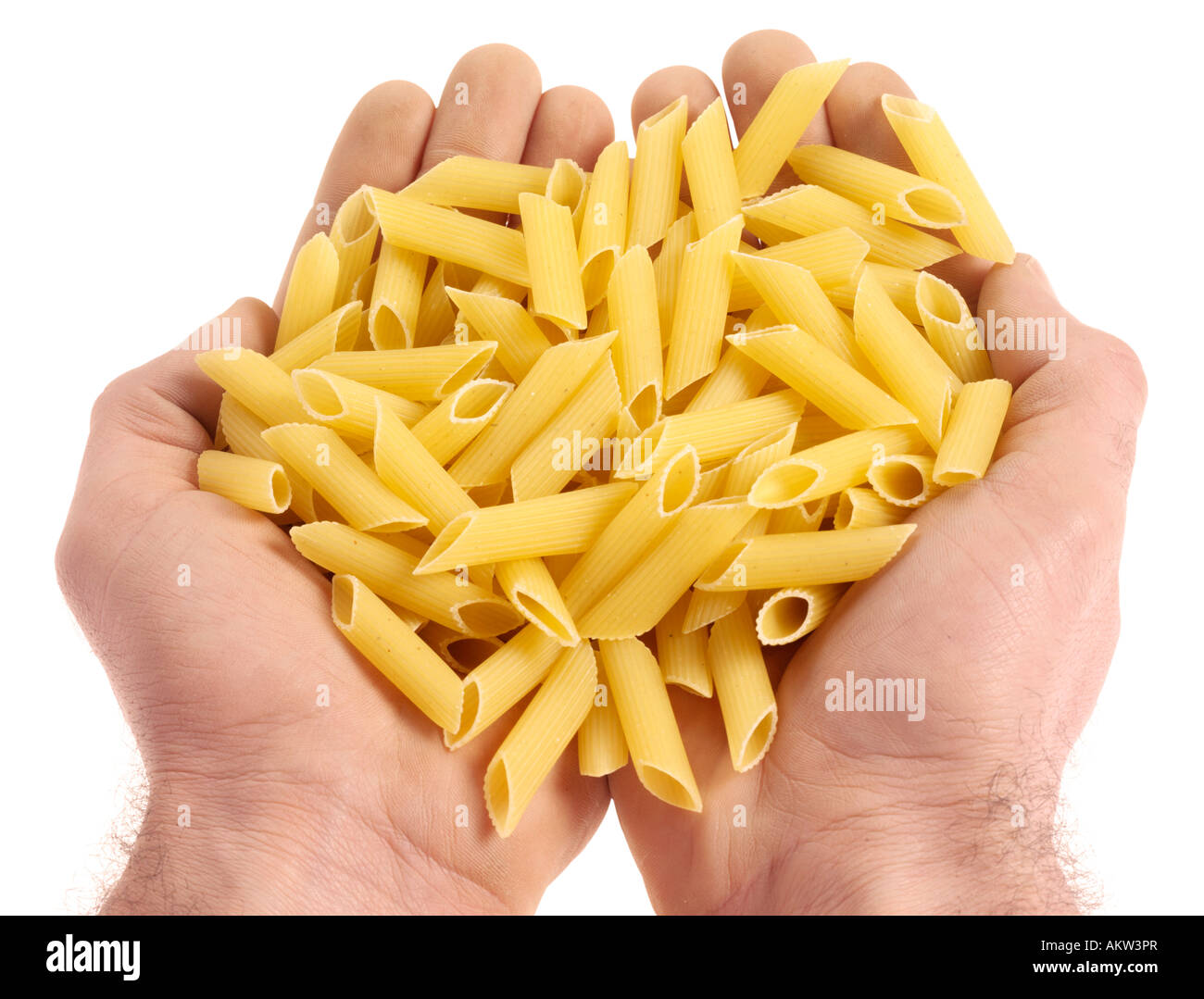 HANDFUL OF PENNE PASTA Stock Photo - Alamy