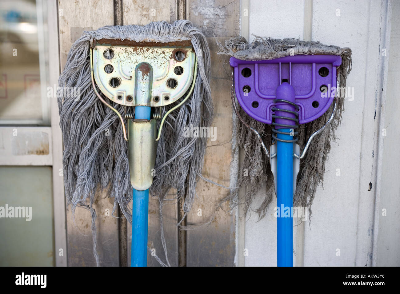 Cleaning Mops outside Shop Stock Photo - Alamy