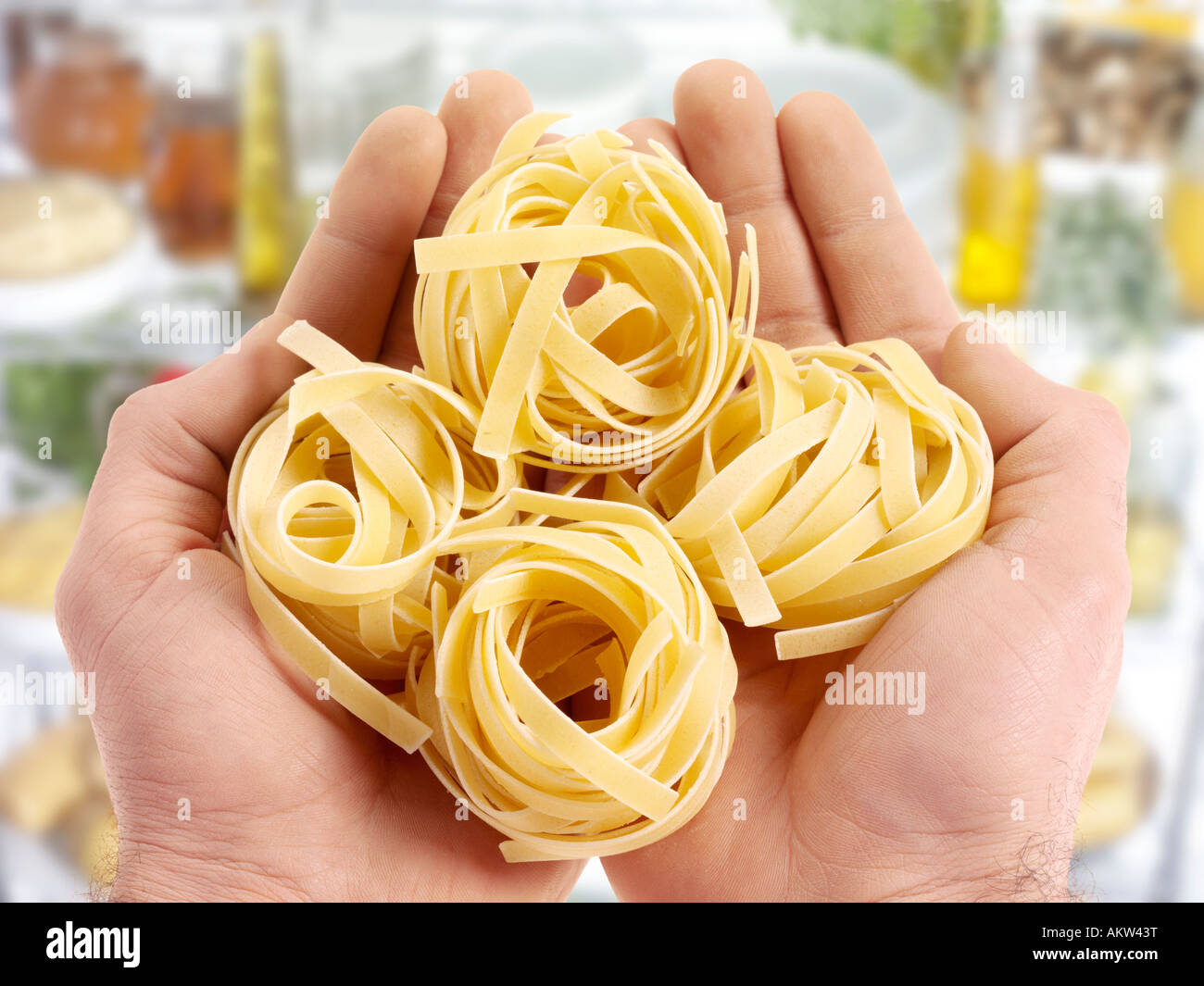 HANDFUL OF TAGLIATELLE PASTA Stock Photo - Alamy