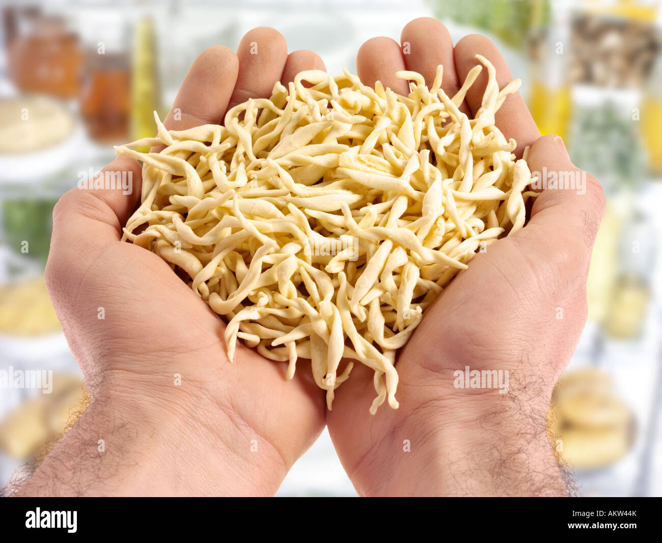 HANDFUL OF TROFIE PASTA Stock Photo - Alamy